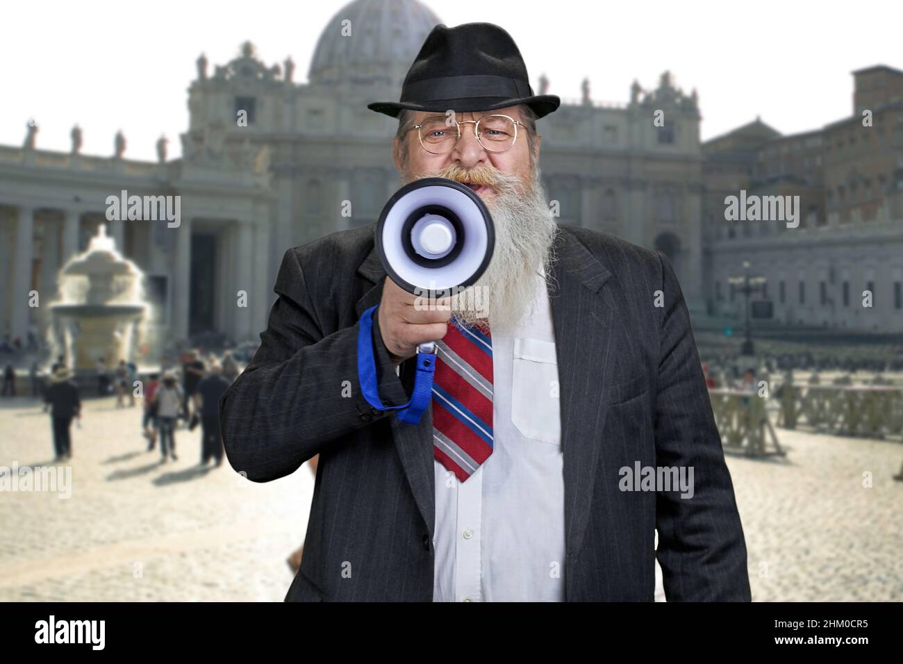 Old bearded businessman making an announcement in megaphone. Blur city ...
