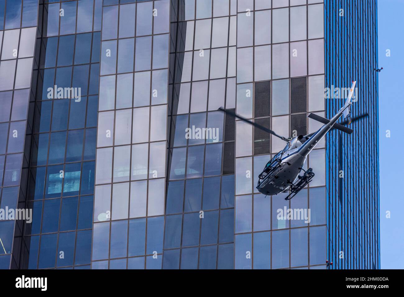 Wien, Vienna: helicopter in front of skyscraper DC Tower 1, reflecting ...