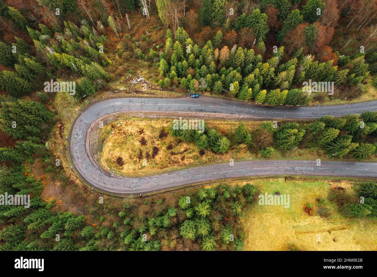 steep and dangerous turns on the road, serpentine roads in the woods ...