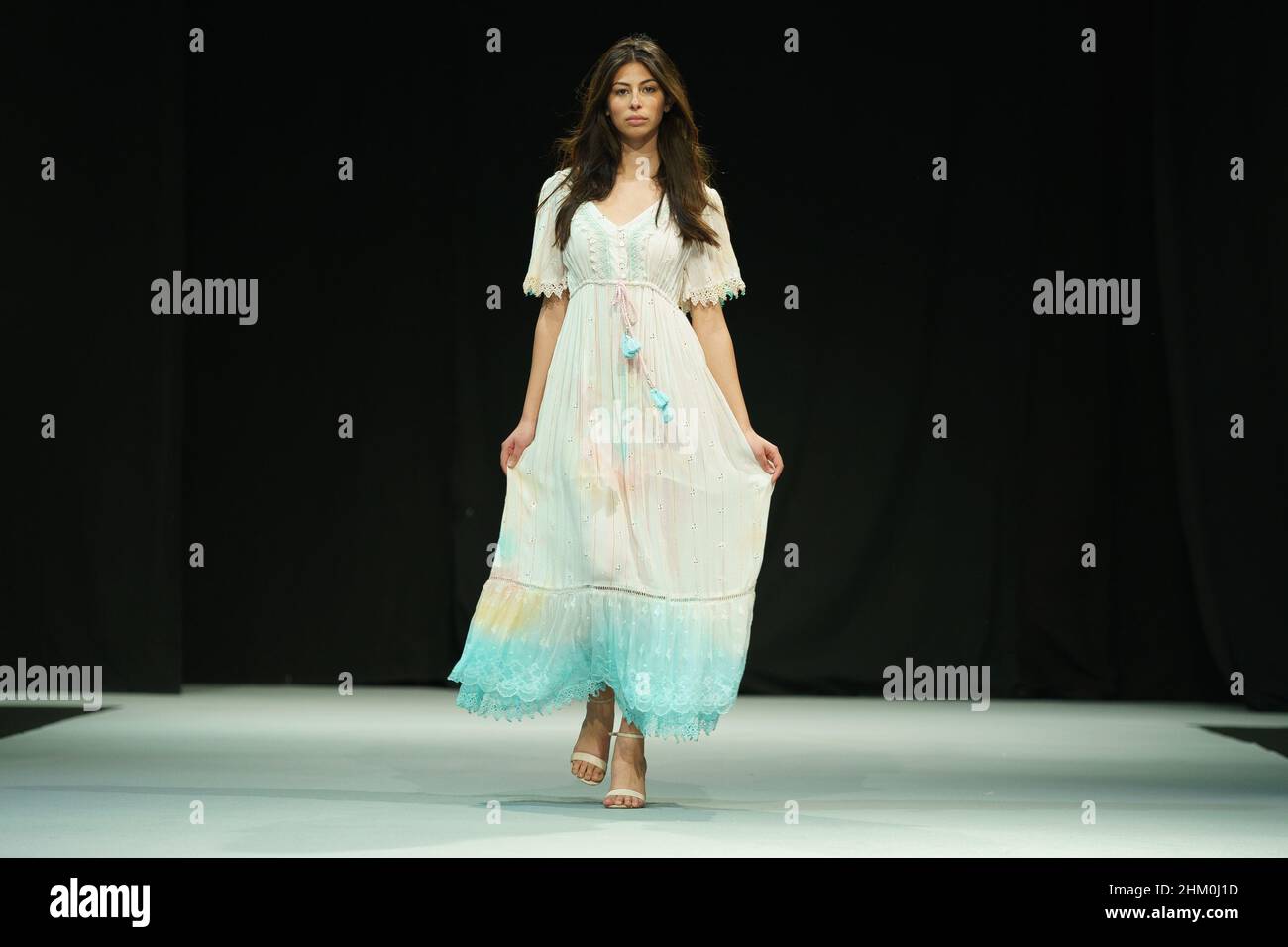 A model walks the runway designed by the Siya Moda fashion show brand ...