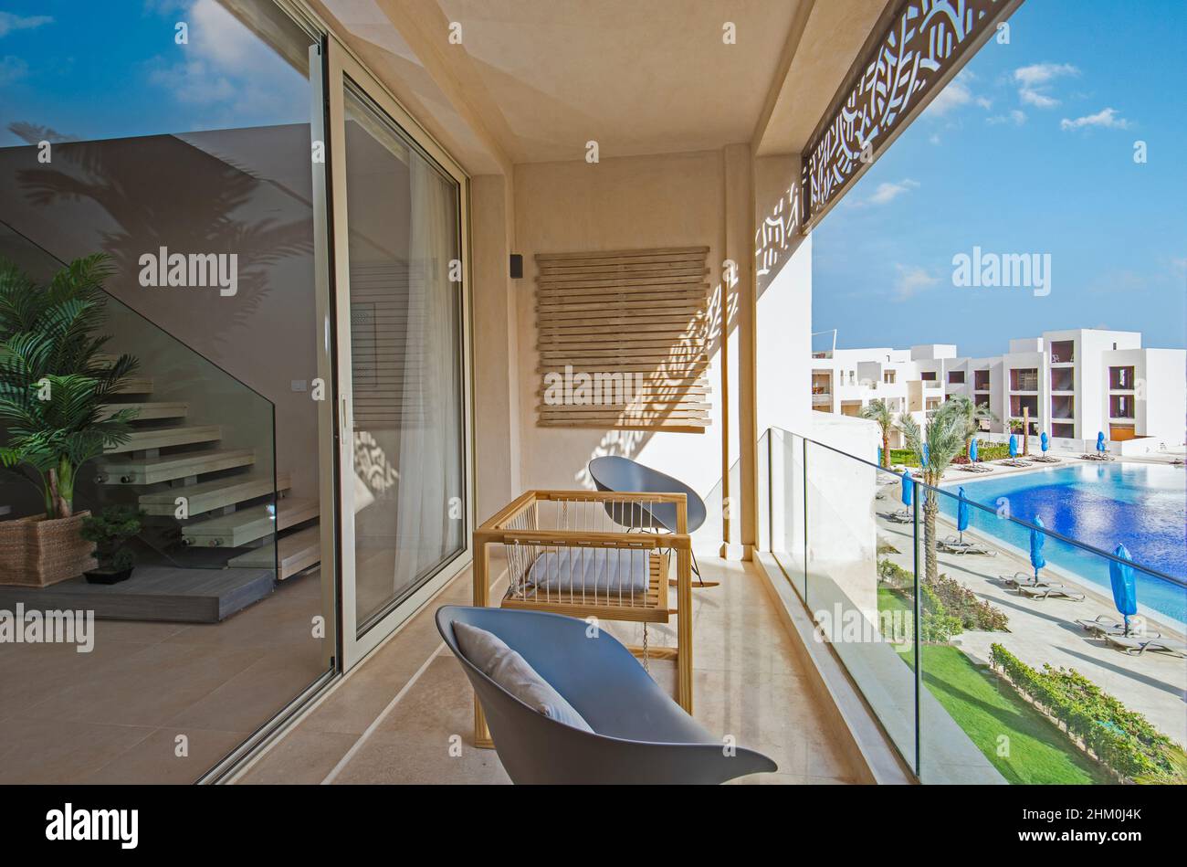 Terrace furniture of a luxury apartment in tropical resort with table ...