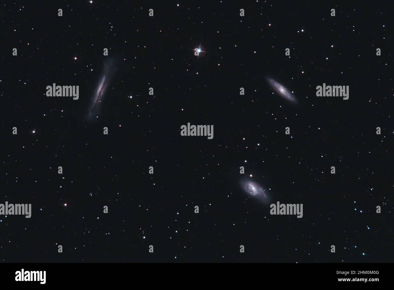 Galaxies in space: Leo triplett, M66 Stock Photo - Alamy