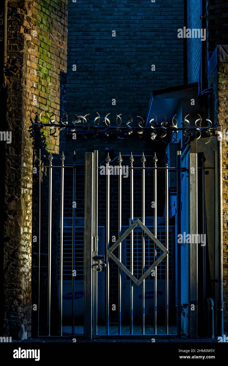 Spiky gate at an industrial site, London, SE1, England, UK Stock Photo ...