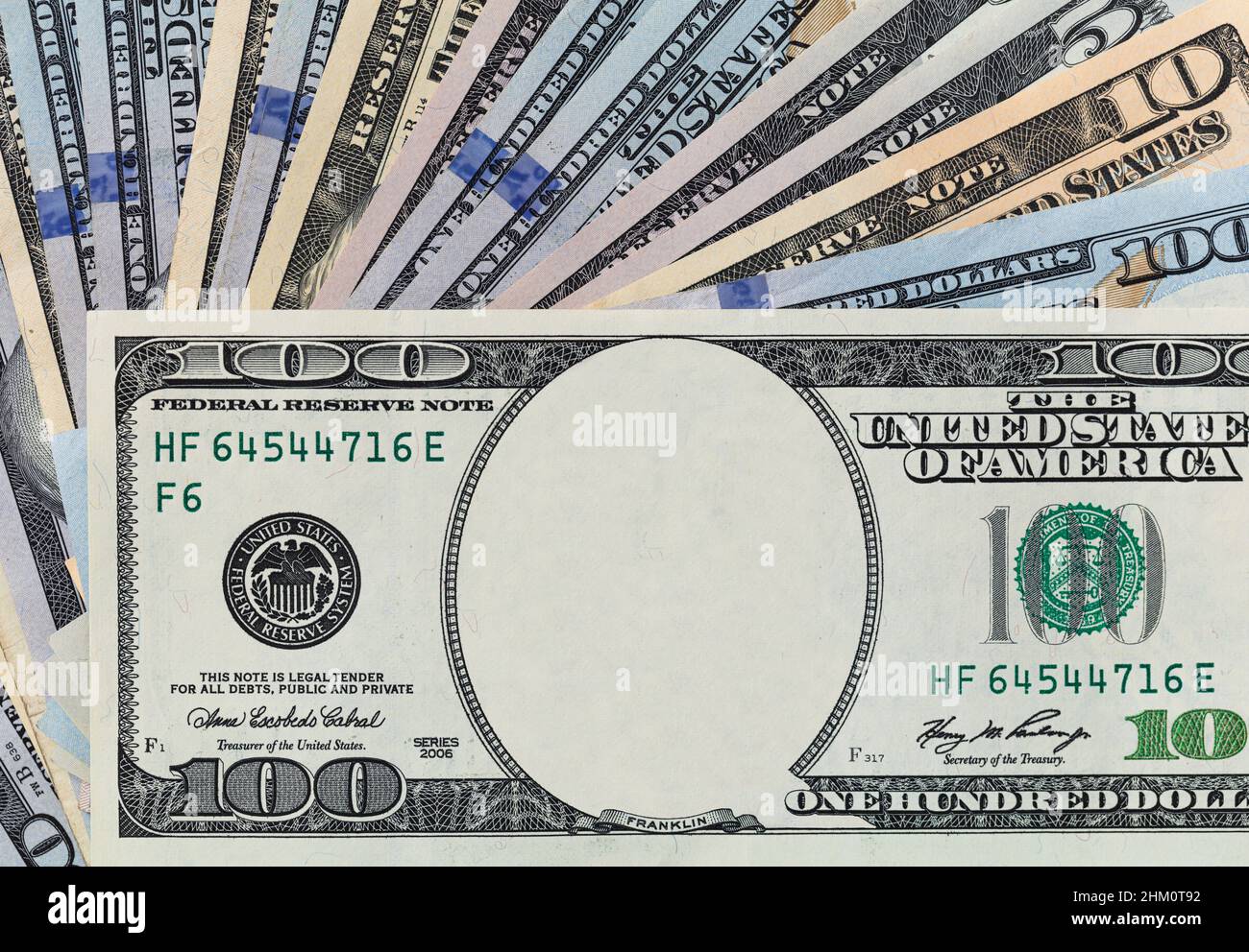 fan of 100 dollar banknotes with empty middle area Stock Photo - Alamy