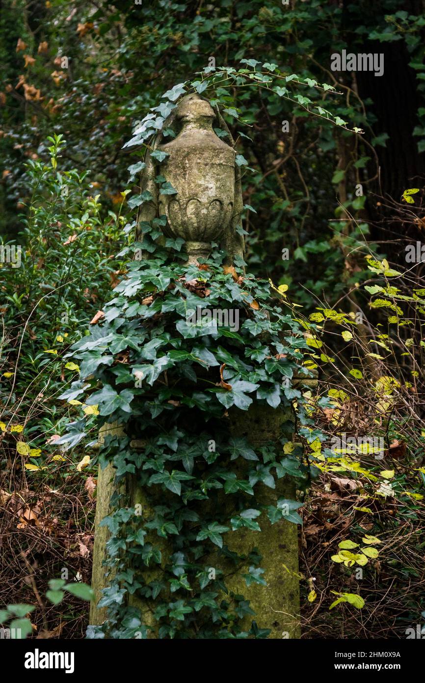 Dilapidated overgrown gravestone, Nunhead Cemetery, London, England, UK ...