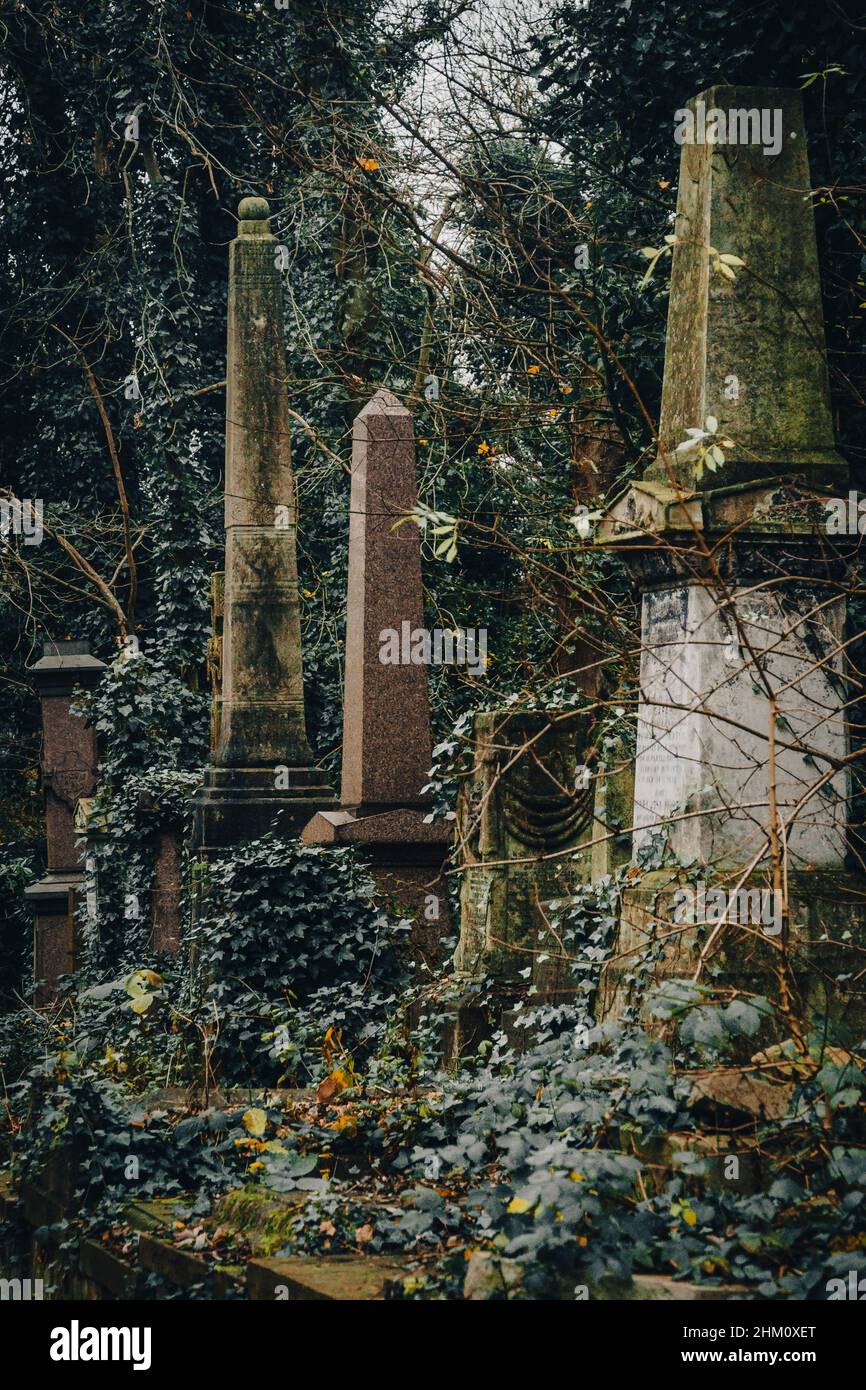 Dilapidated overgrown gravestone, Nunhead Cemetery, London, England, UK ...