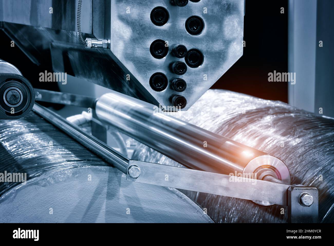 The operation of automatic plastic bag production machine. Close-up of ...