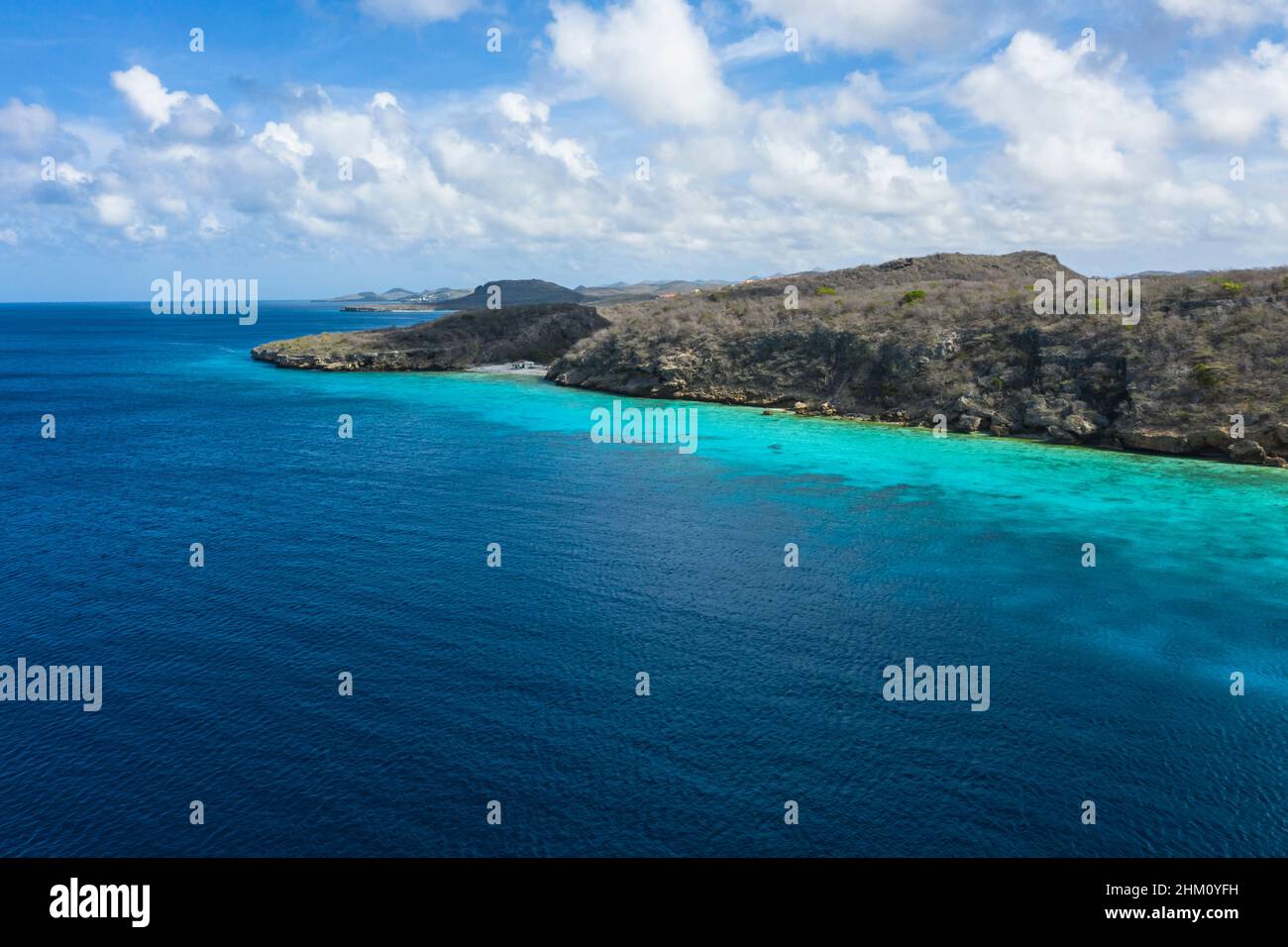 Aerial view of coast scenery with the ocean, cliff, and beach around ...