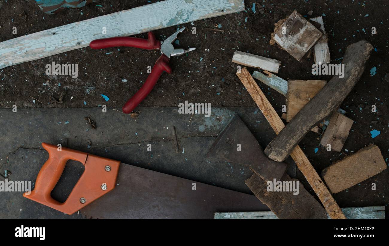 Old tools are lying on the ground. Construction tools for home repair ...