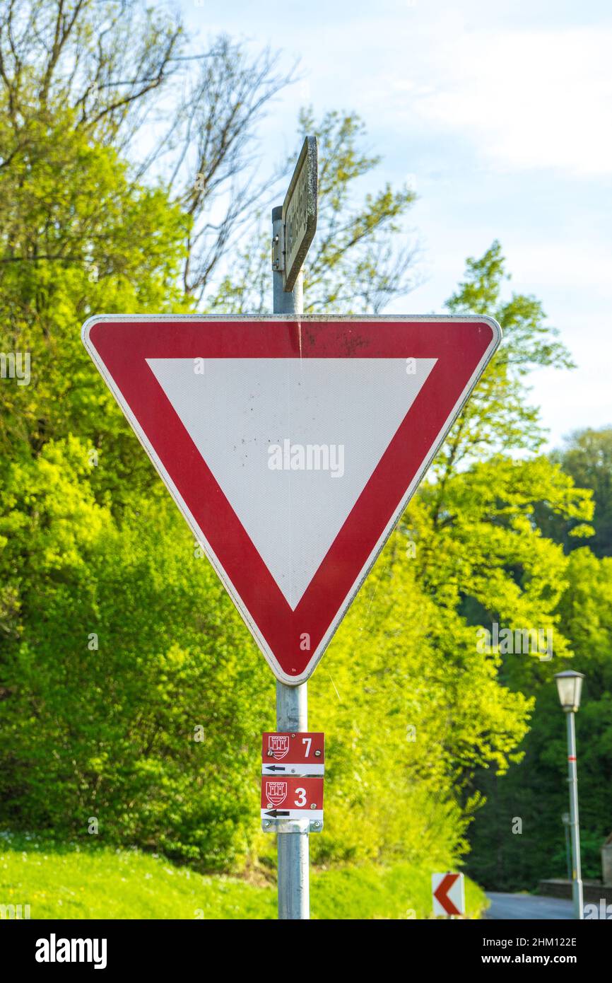 Vertical photo of a triangle street traffic sign in Rothenburg ob der ...