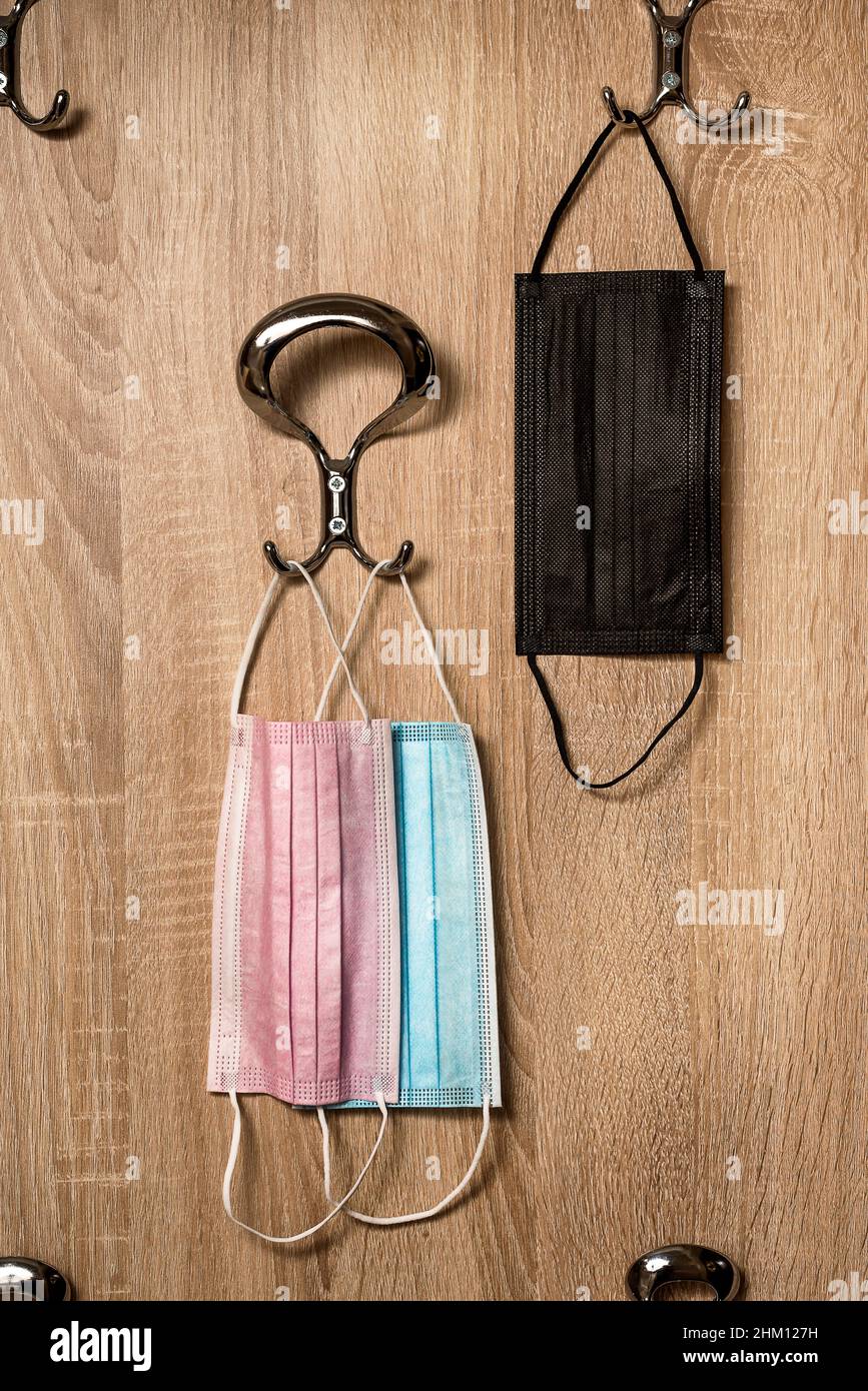 Protective surgical face masks on anteroom coat hanger stand during ...
