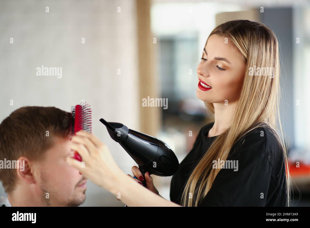 Professional hairdresser woman doing hi-res stock photography and ...