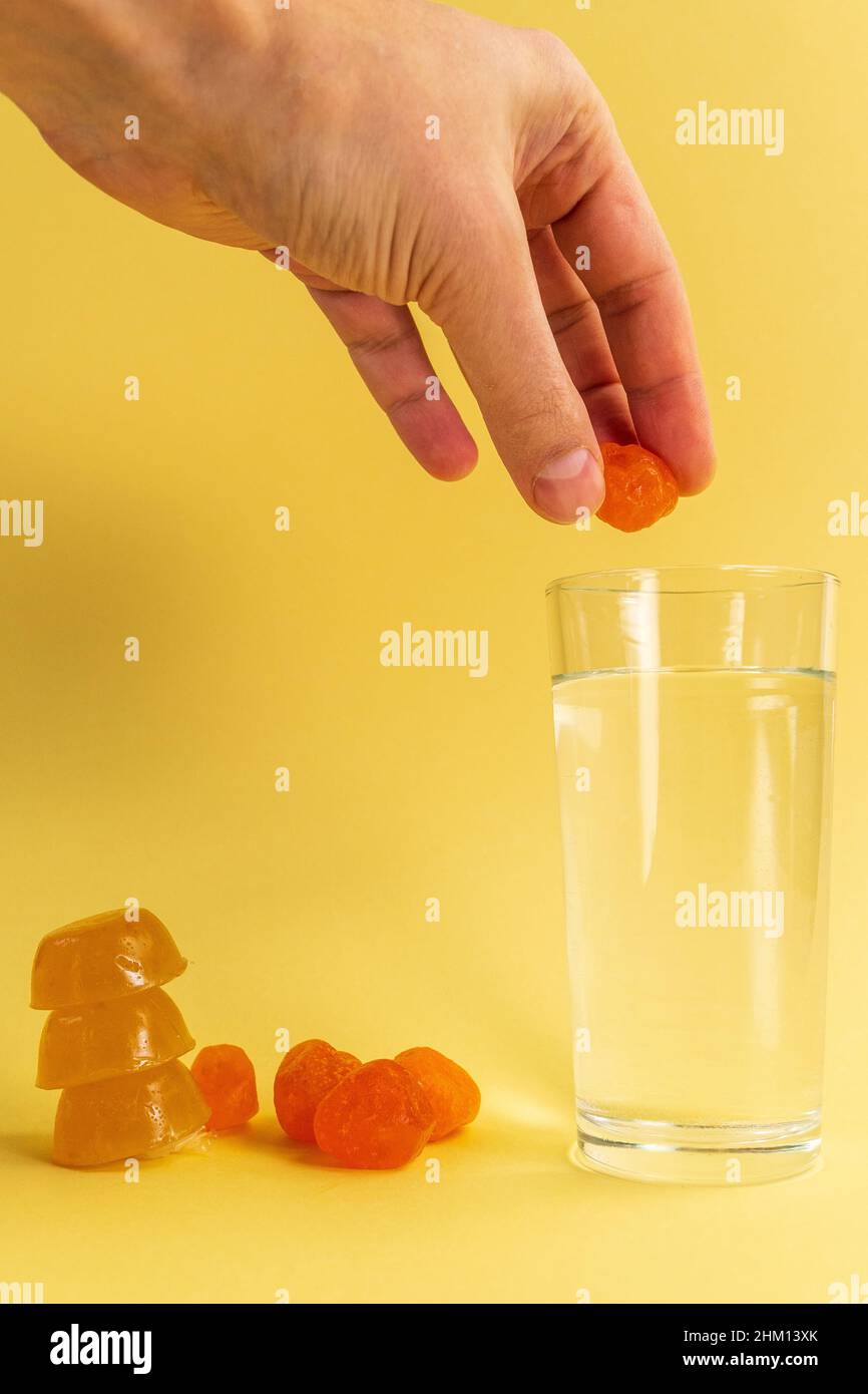 Dissolvable drinks dissolving cubes to add superfoods. On a yellow ...