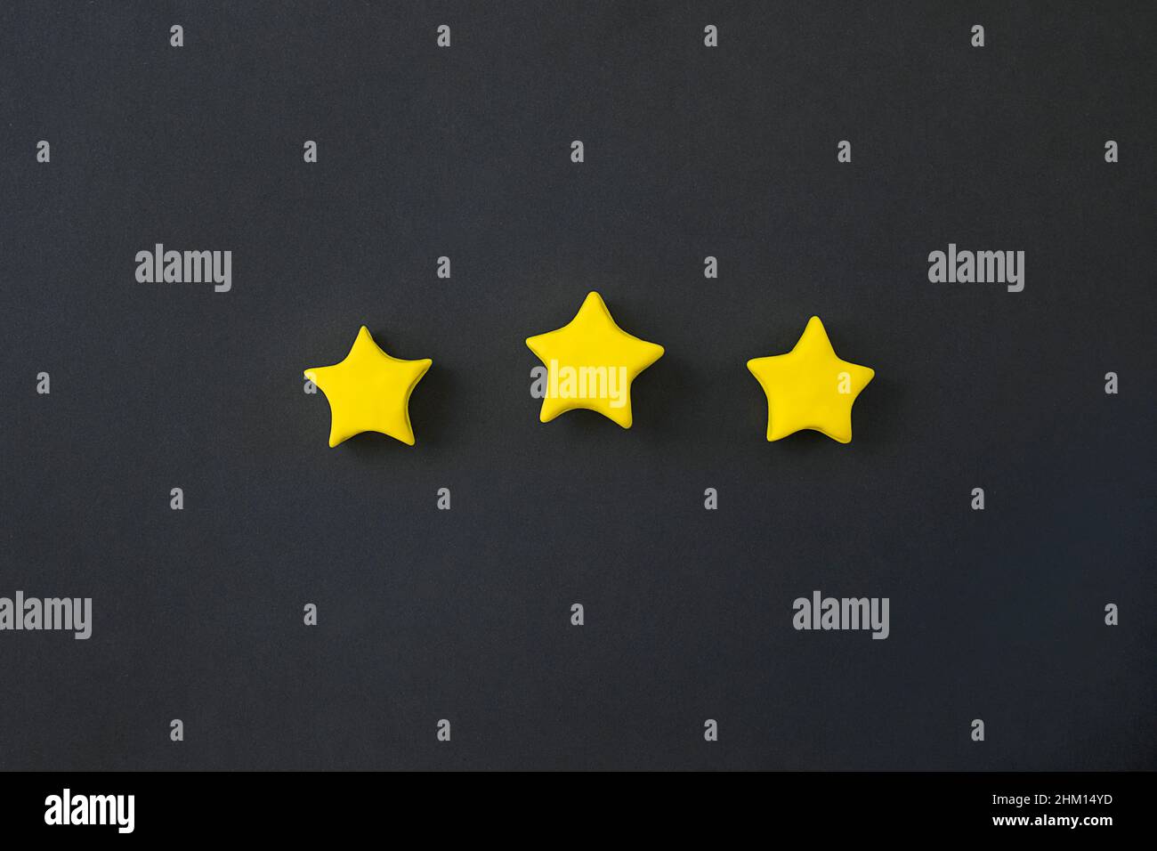 Three golden star on black background. Golden star shape. Concept of ...