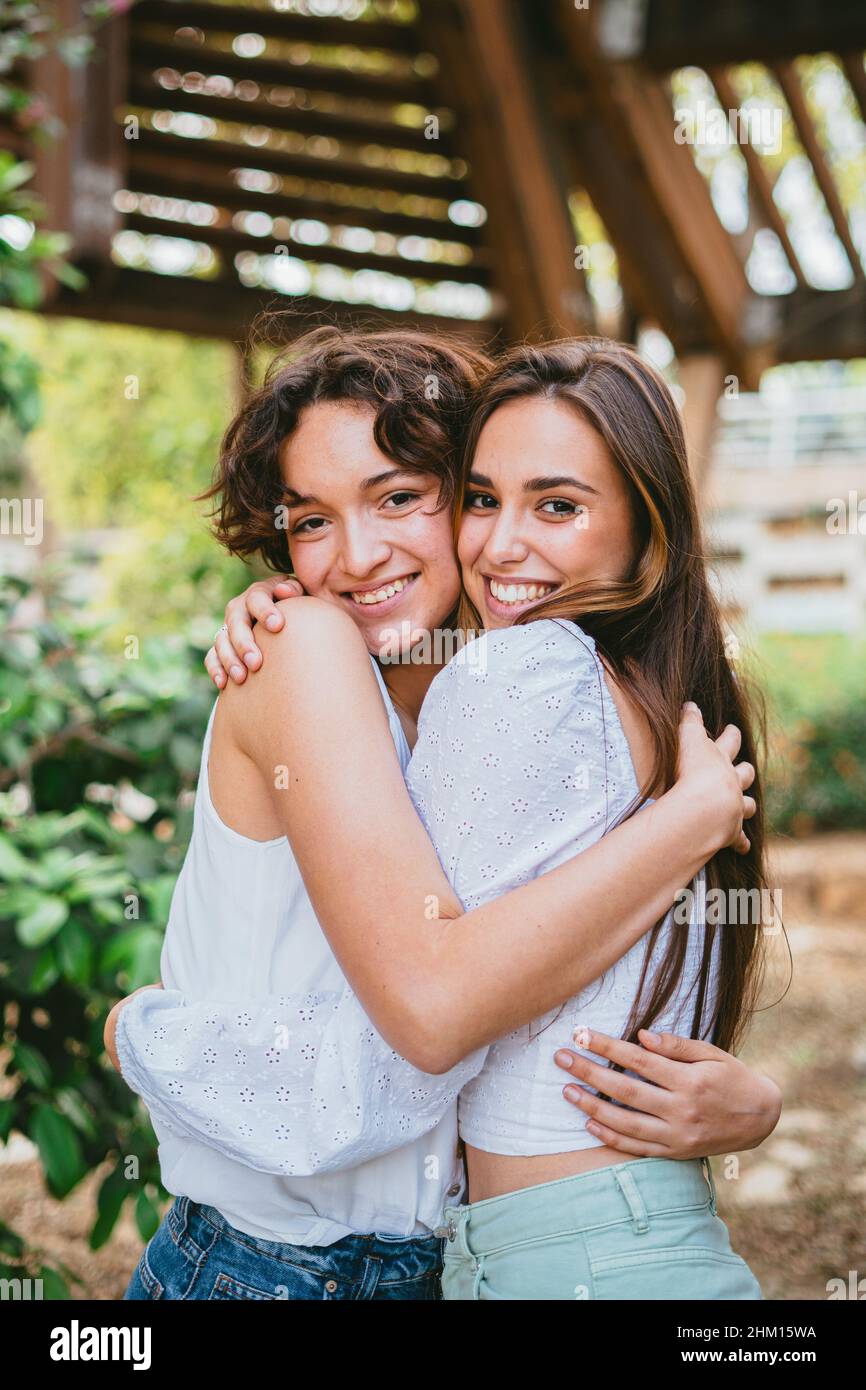 Teenage friends girls hugging hi-res stock photography and images - Alamy