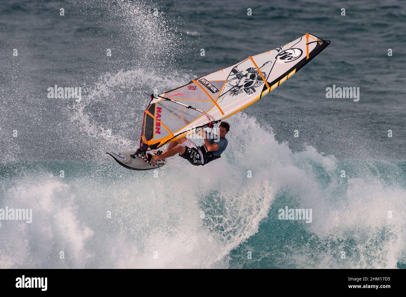 Windsurfer sailing in big waves at Ho'okipa Beach, Maui, Hawaii, USA ...