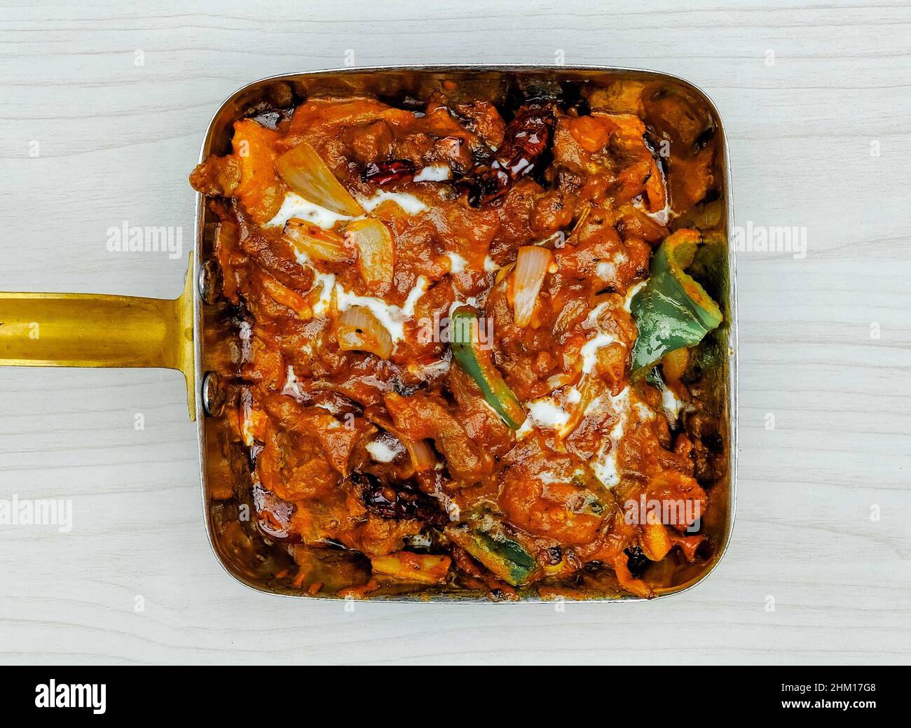 mutton karahi in a dish top view on grey background Stock Photo - Alamy