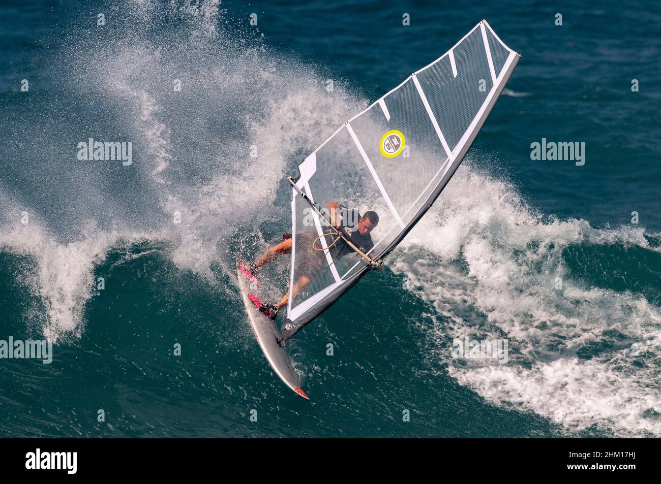 Windsurfer sailing in big waves at Ho'okipa Beach, Maui, Hawaii, USA ...