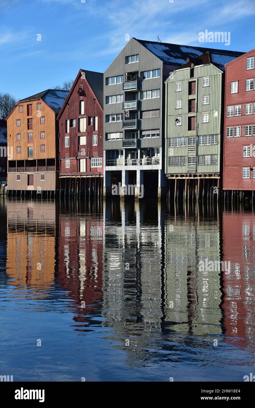 Colourful buildings reflect in the Nidelva River, north of Old Town ...