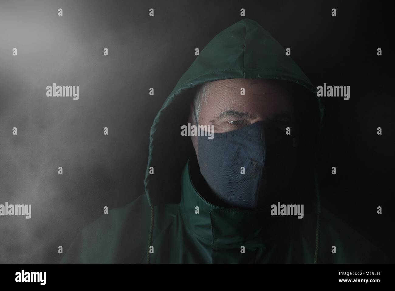 Masked man in the fog Stock Photo - Alamy