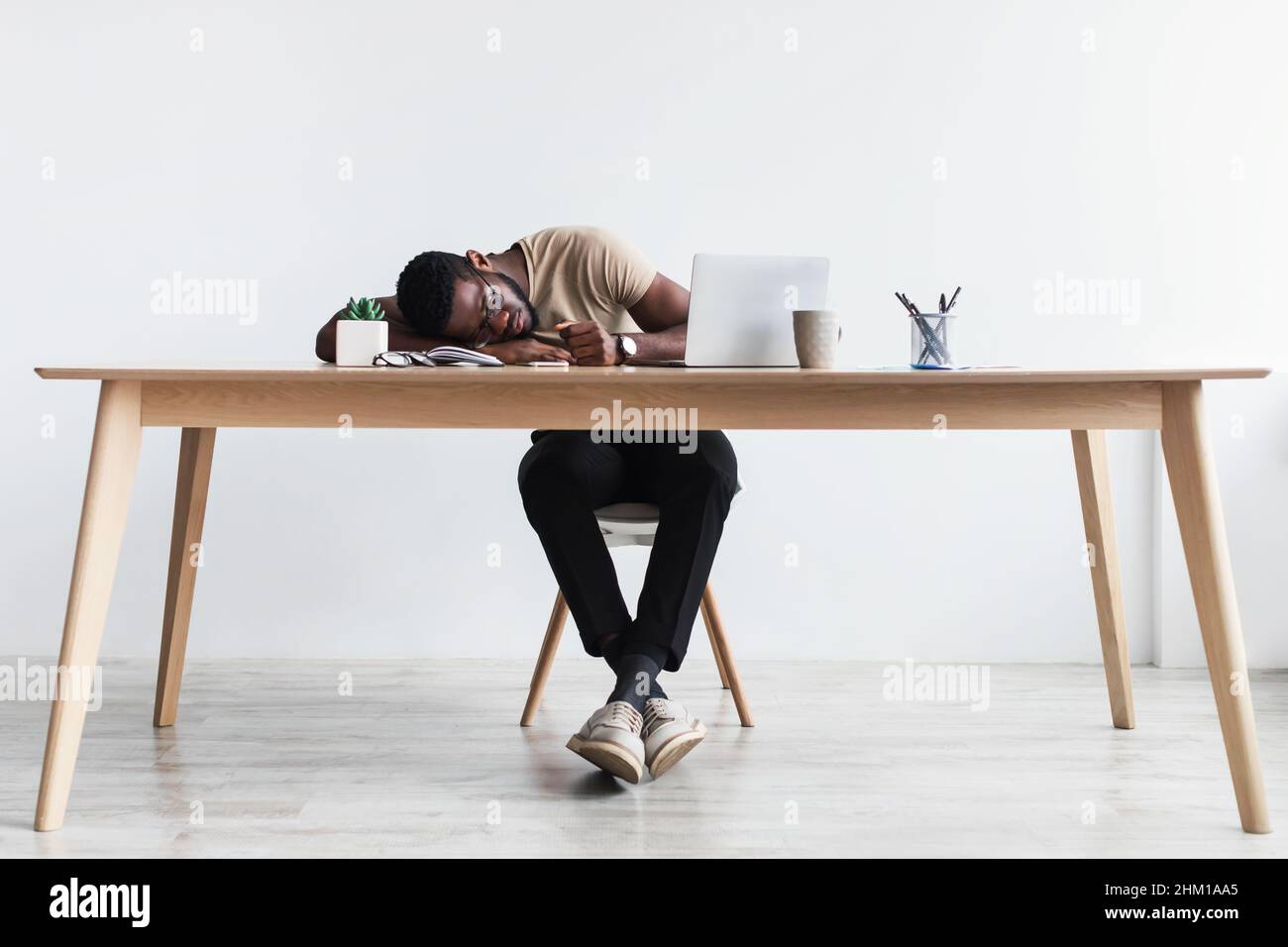 African man laptop taking nap hi-res stock photography and images - Alamy