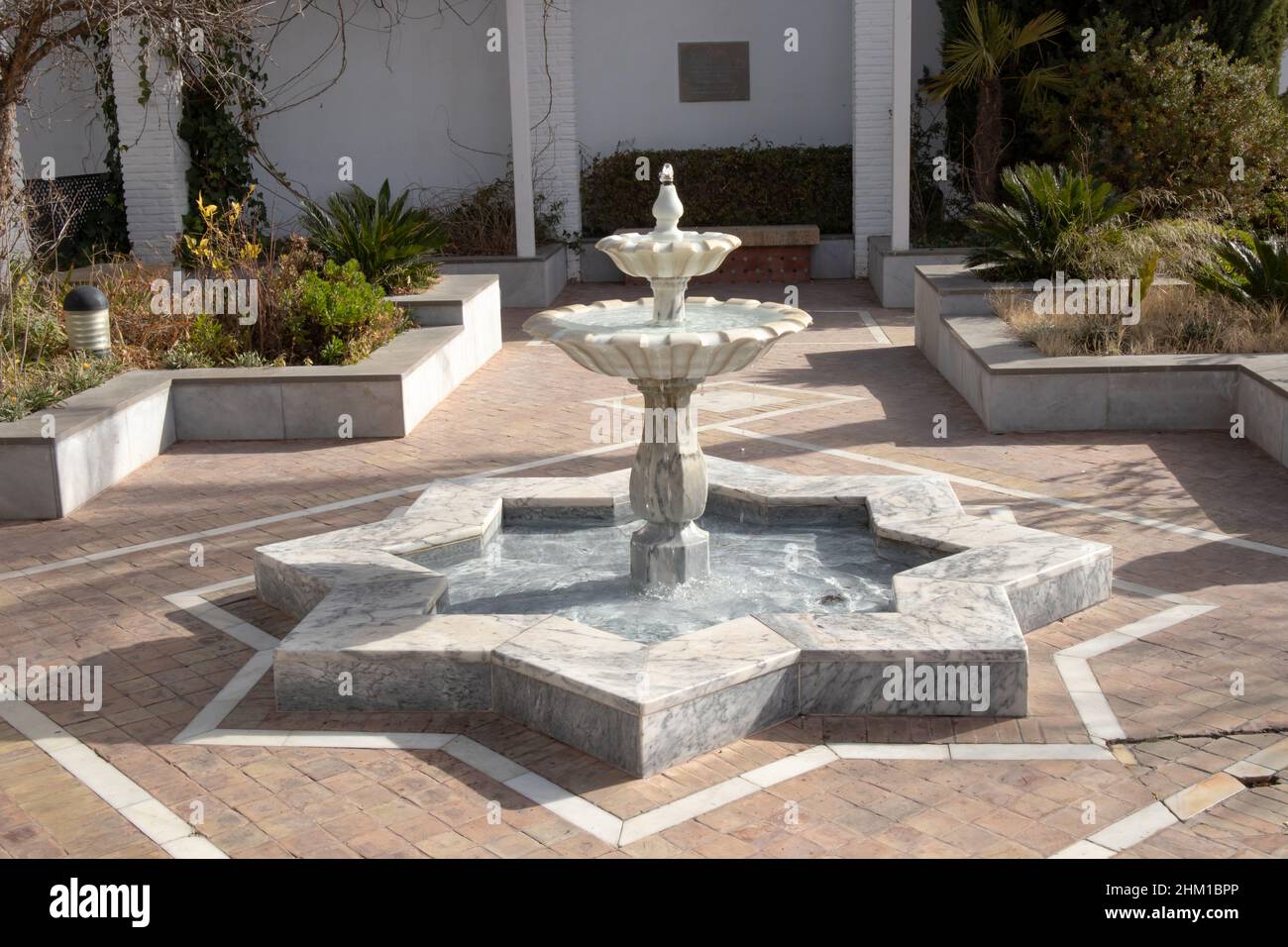 An empty public fountain dries up due to the drought shaped like an ...