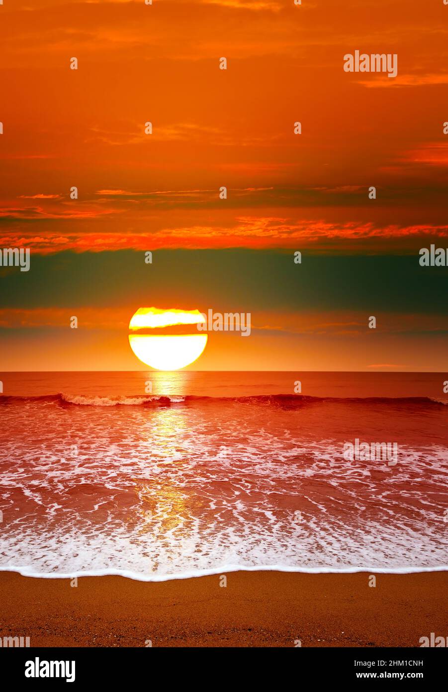 Epic sunset over ocean, sea waves and sand Stock Photo - Alamy