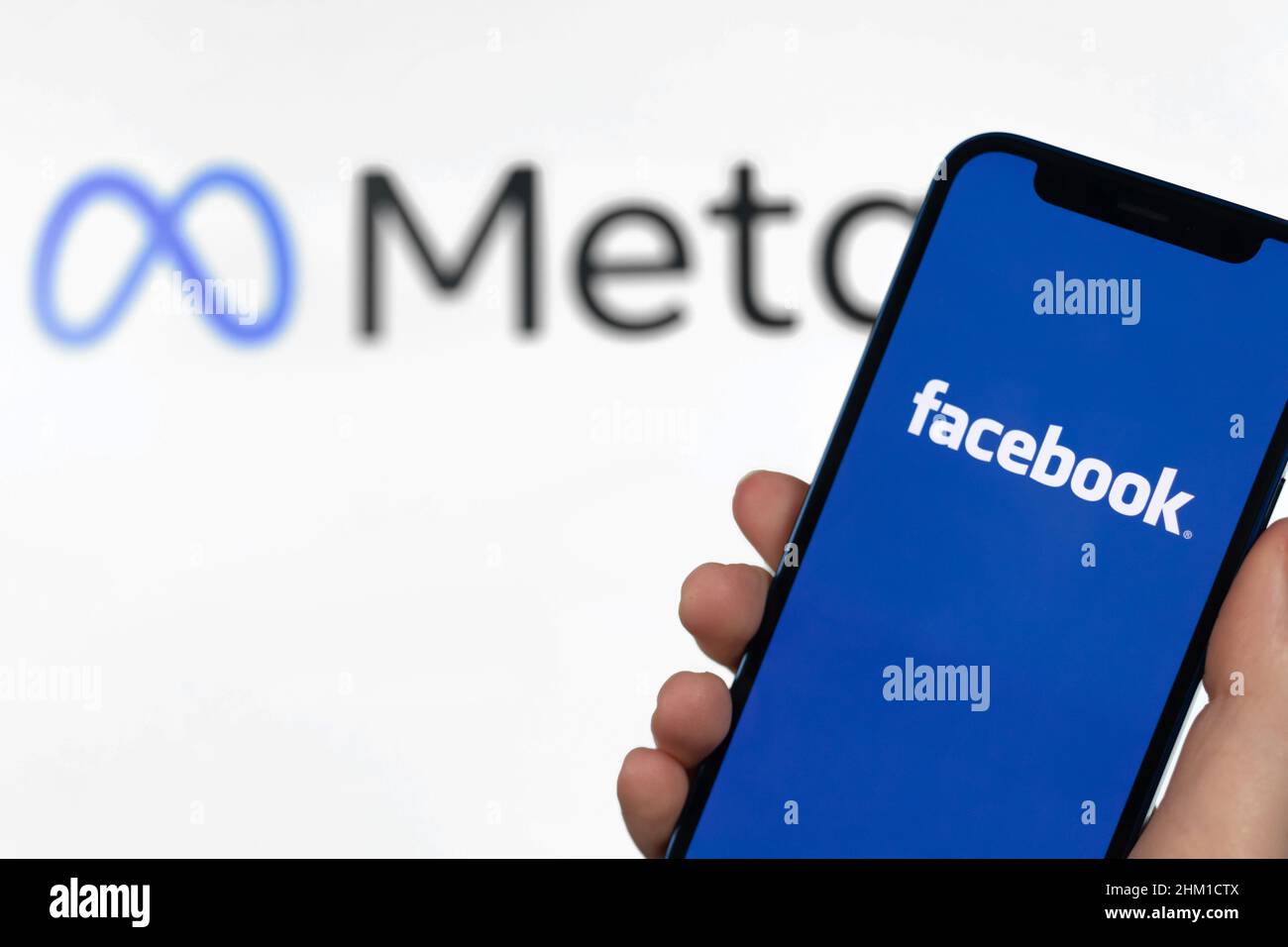 Facebook and Meta logo. Metaverse concept background photo Stock Photo ...