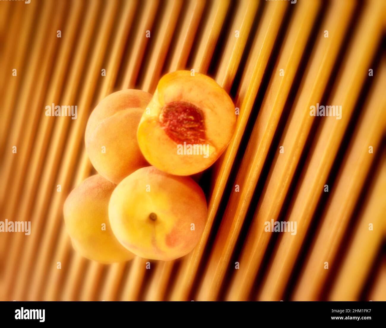 Succulent close-up food / fruit still life of peaches against a ...