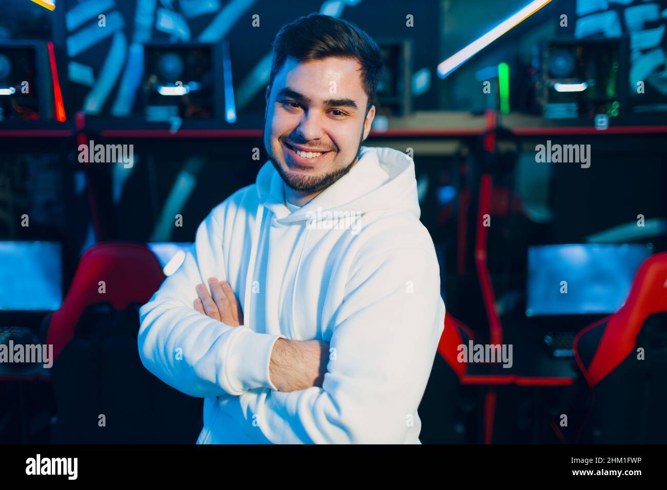 Young guy businessman entrepreneur owner gamer staying smiling on ...