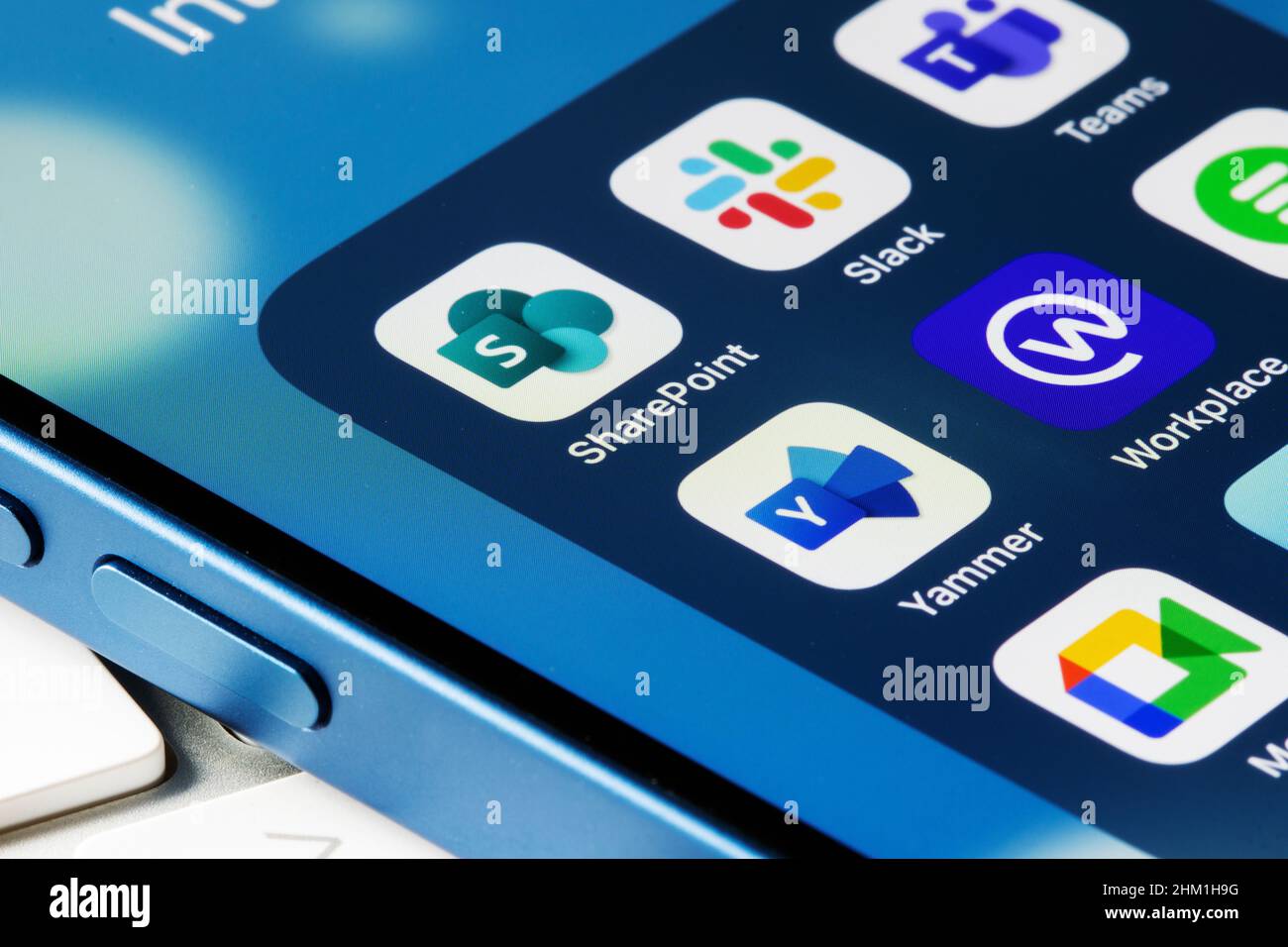 Assorted intranet apps are seen on an iPhone, including Microsoft ...