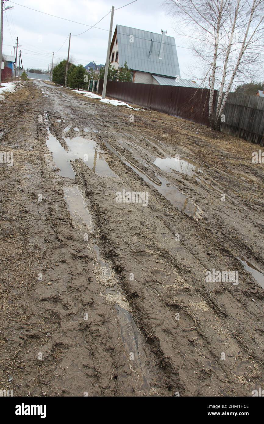 Terrible road in the village Stock Photo - Alamy