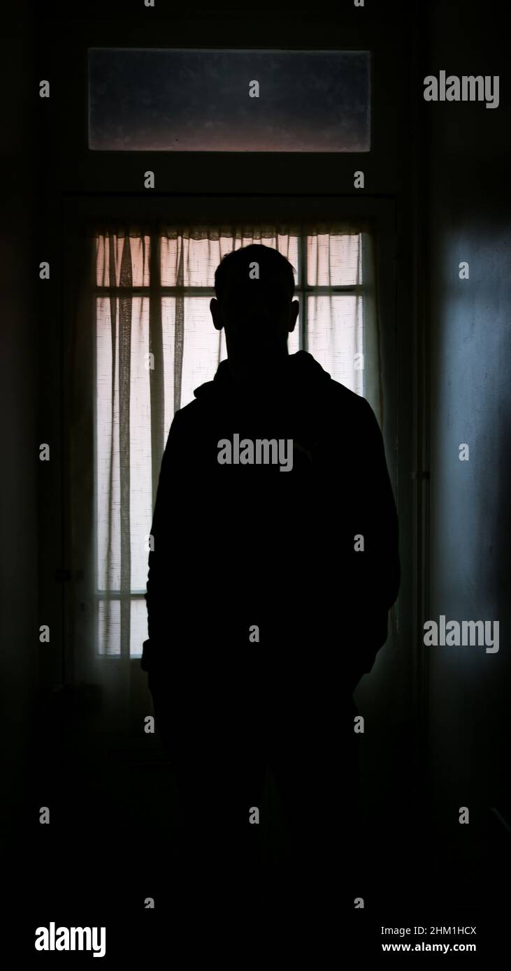 SALISBURY, UK. A man stood in the doorway of a house in Lower Bemerton ...