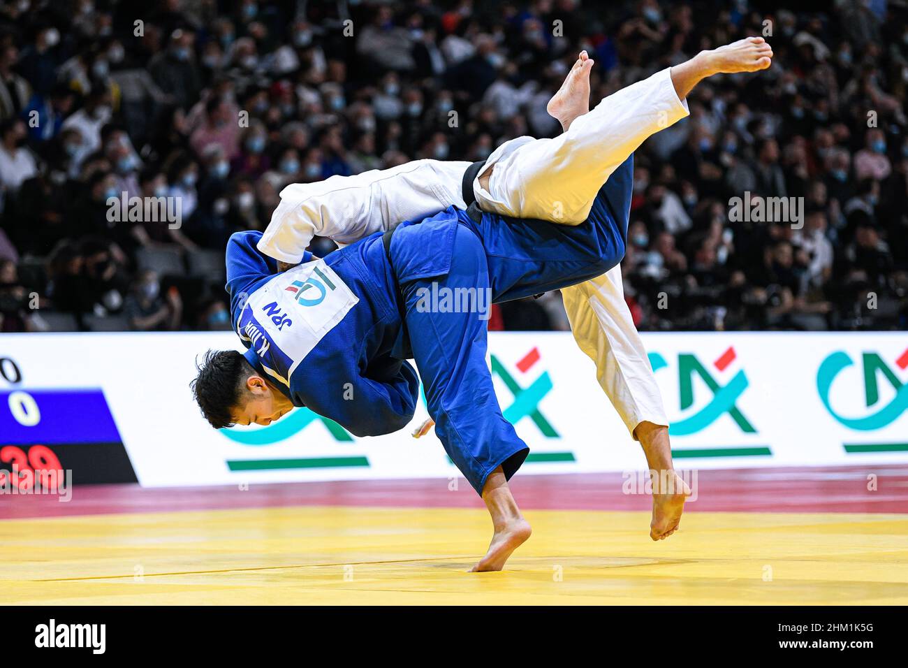 Men's -100 kg, Kentaro Iida (blue) of Japan competes and throws (uchi ...