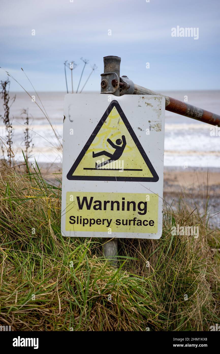 Cromer, Norfolk, UK – February 2022. Slippery surface warning sign on ...