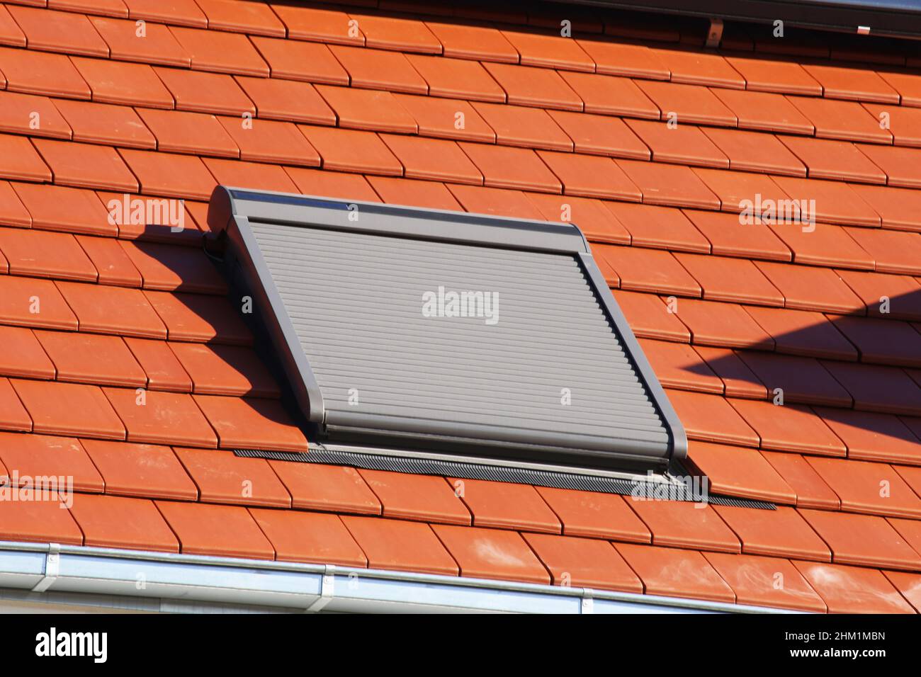 Roof window with roller shutter Stock Photo - Alamy