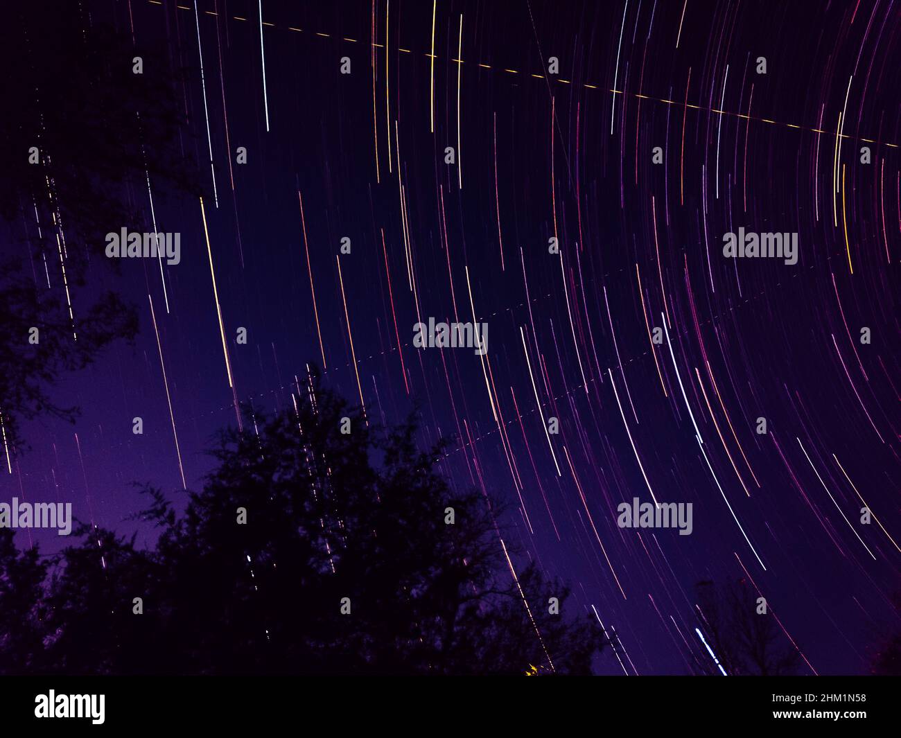 Beautiful meteor shower in the night sky Stock Photo - Alamy