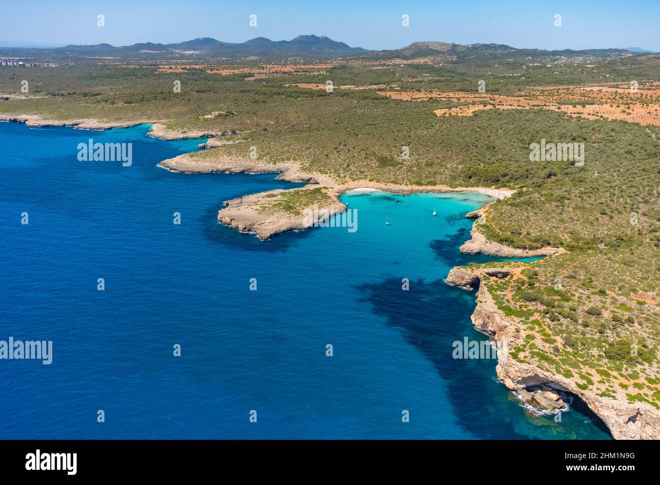 Aerial view, cove, caves and beach Cala Varques, Punta de Llevant ...