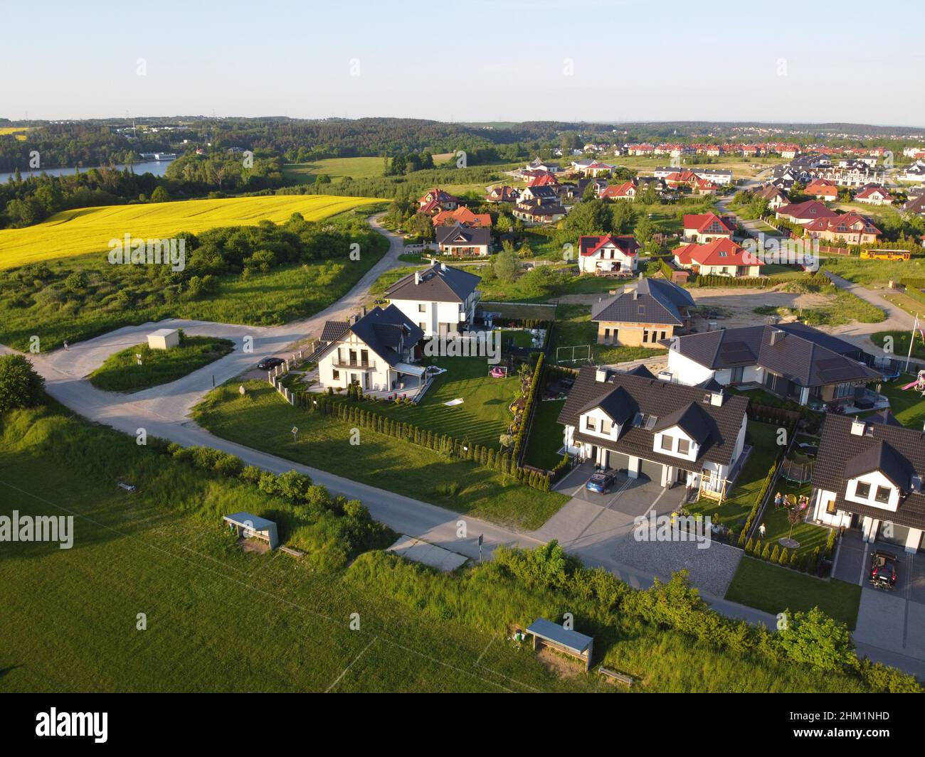 Residential neigborhood in sunset, bird eye view. Suburbs or village ...