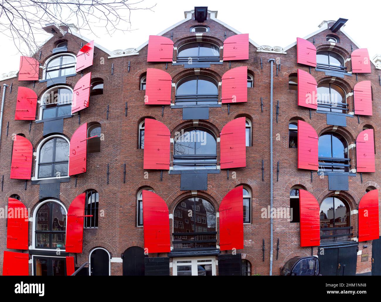 Facade of an old Dutch house with red shutters in Amsterdam Stock Photo ...