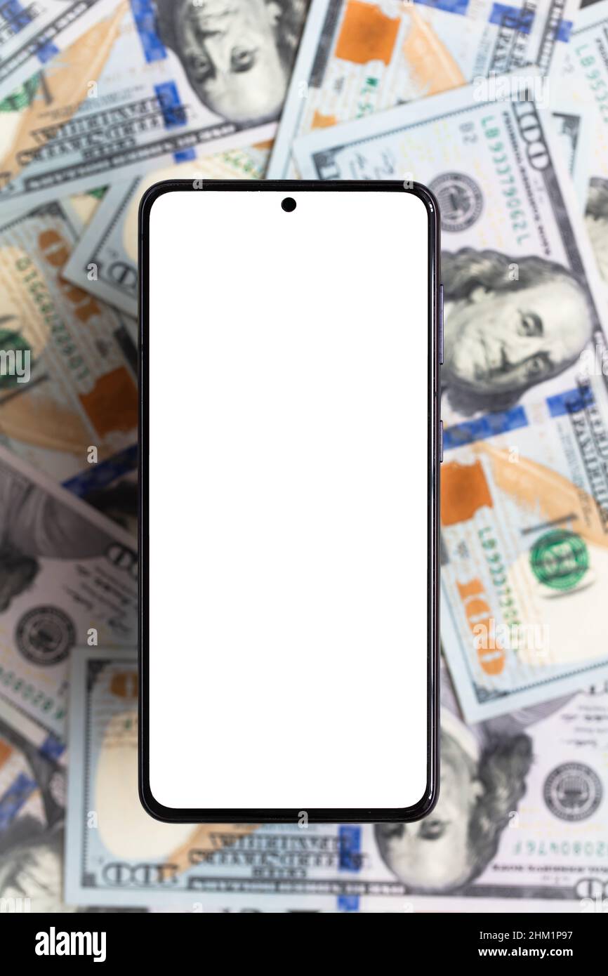 white smartphone screen on US dollar banknotes background for design ...