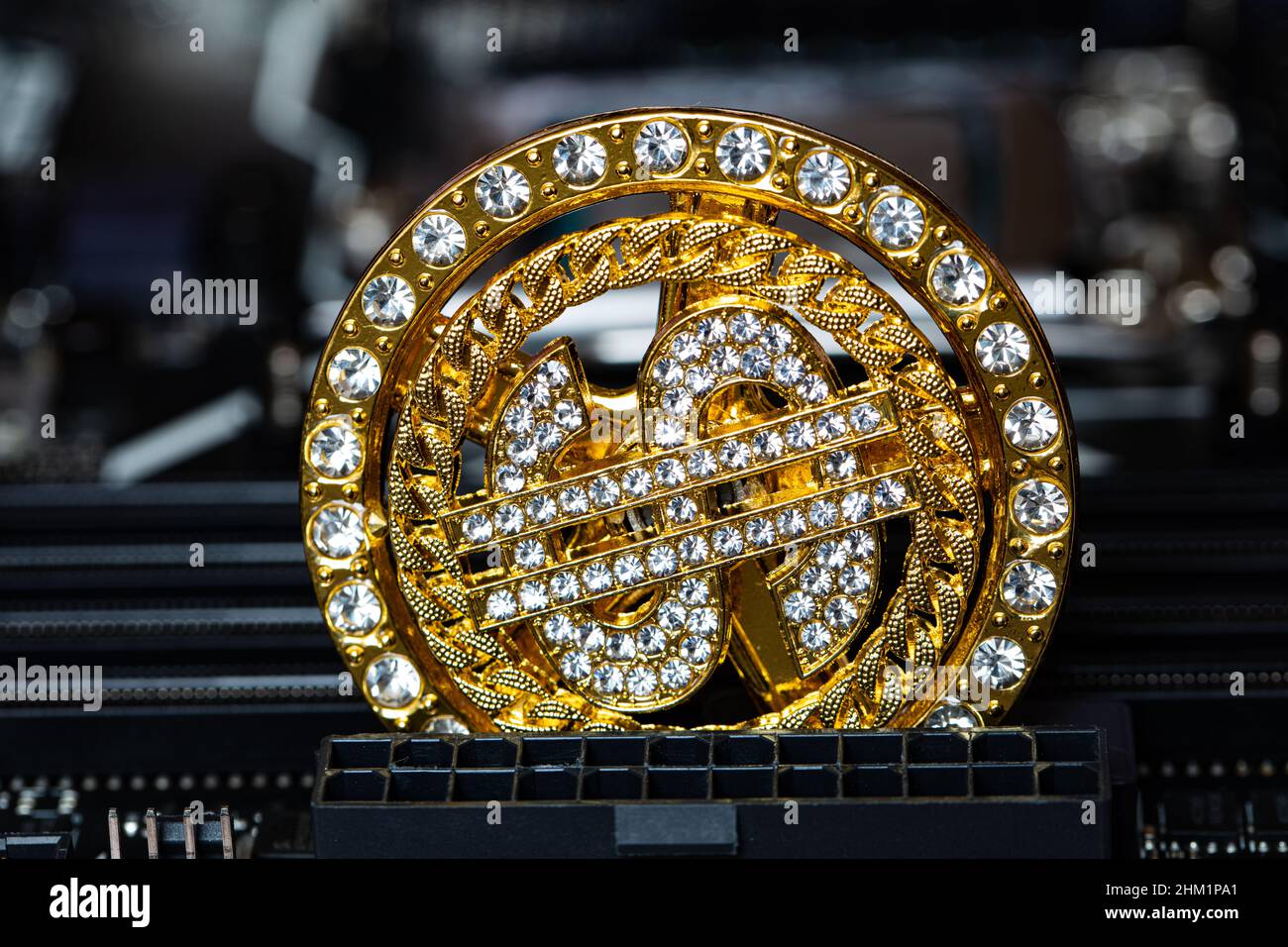 golden dollar sign with gemstones on computer motherboard background ...