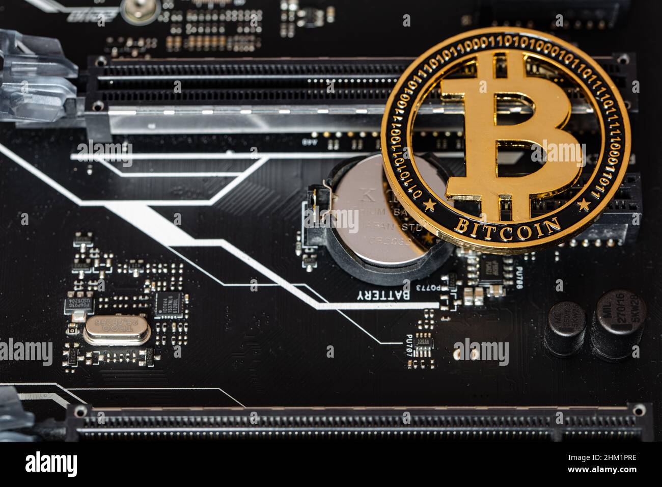 Bitcoin on computer motherboard background. Cryptocurrecy concept Stock ...