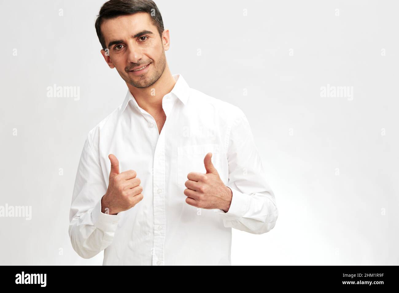 successful man in a white shirt a pensive look self-confidence light ...