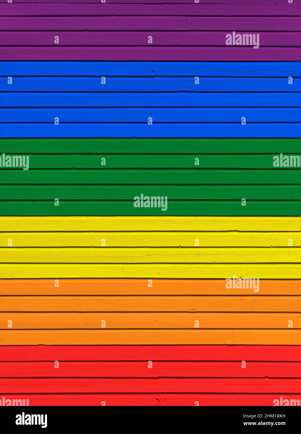 Wood board wall painted in rainbow flag colors. Abstract textured ...