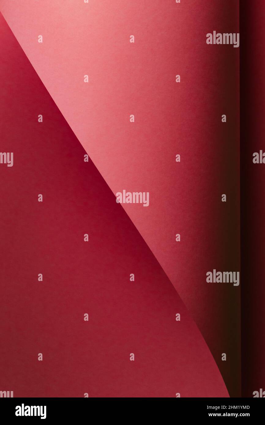 A vertical pink flat lay background with sharp layers and shadows with ...