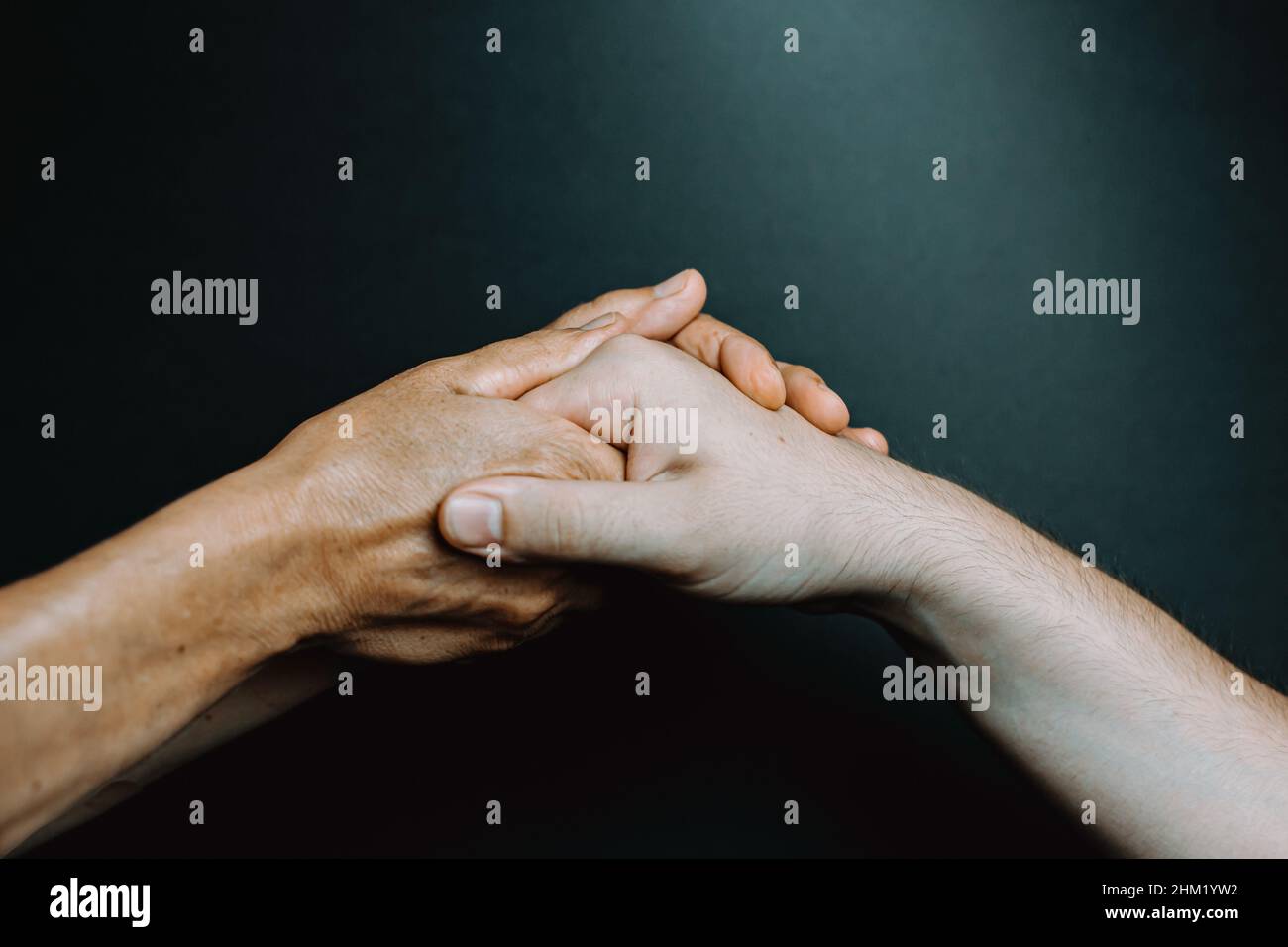 Old young hands touching hi-res stock photography and images - Alamy