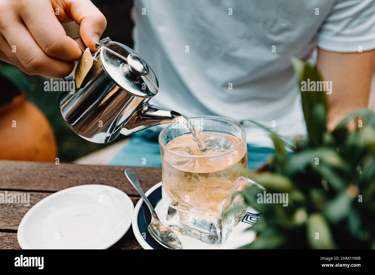 Man pouring dry black tea hi-res stock photography and images - Alamy