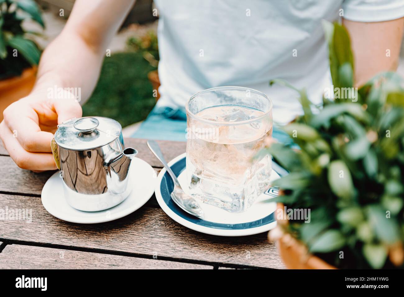 A young male getting ready to prepare a tea in a modern bar Stock Photo ...