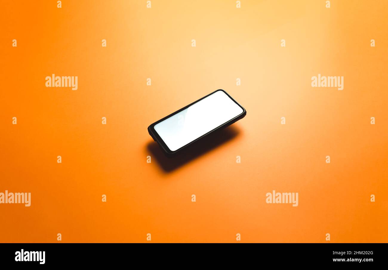A minimalistic mock up flat image design with a floating mobile phone ...
